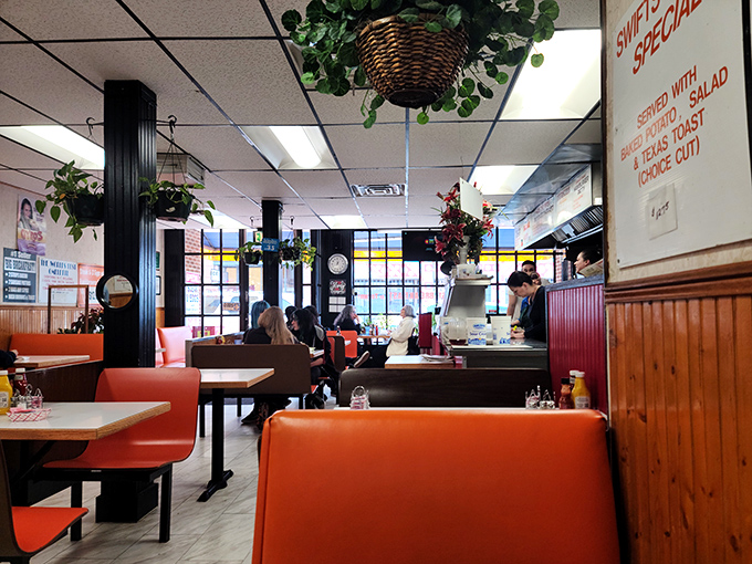 A feast for the eyes and stomach! Swift's decor is a charming mix of retro cool and homey comfort, with a side of hanging plants.