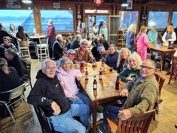 Happy diners, cold beers, and sunset views. It's like a Norman Rockwell painting, but with better seafood.
