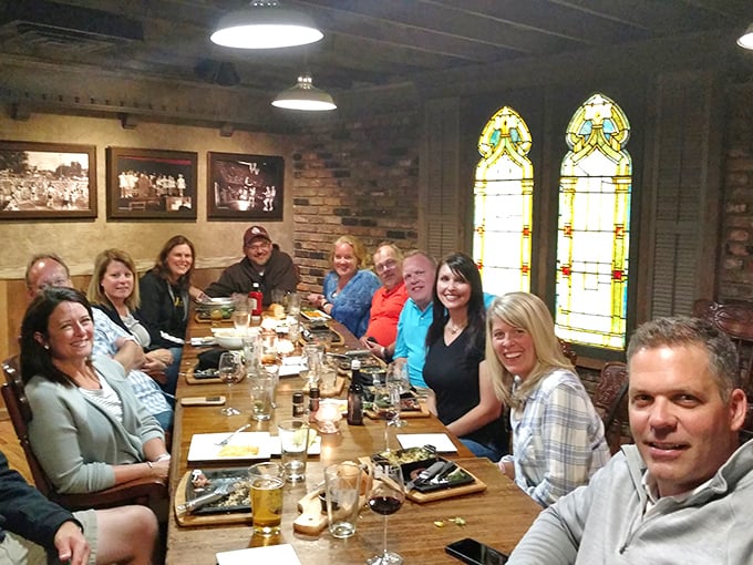 Happy faces and full plates - the universal language of a great meal! This group looks ready to swap stories and clean their plates.