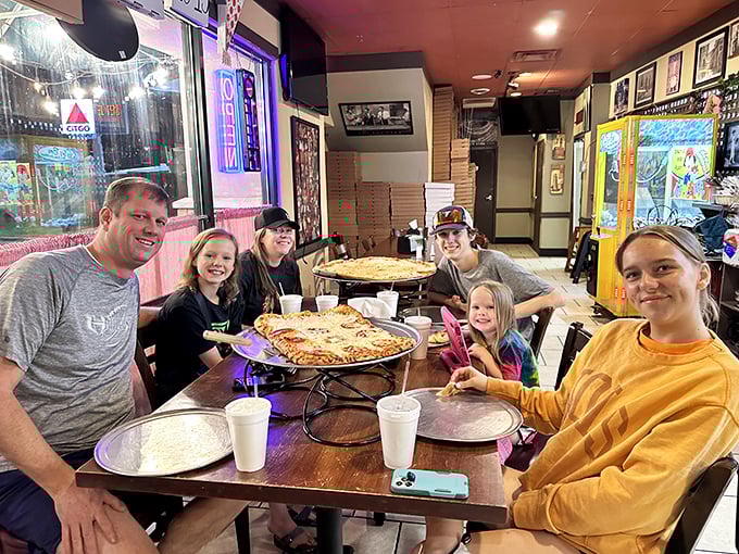 Happy faces around the table prove that pizza is the ultimate crowd-pleaser. It's like a hug for your stomach.