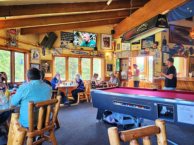 Where locals and visitors share tables and tales beneath wooden beams, with a pool table standing ready for friendly post-dinner competition.