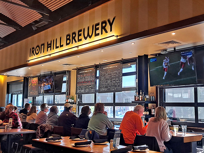 Where strangers become temporary dining companions under the warm glow of Iron Hill's signature lighting. Community by way of craft beer.