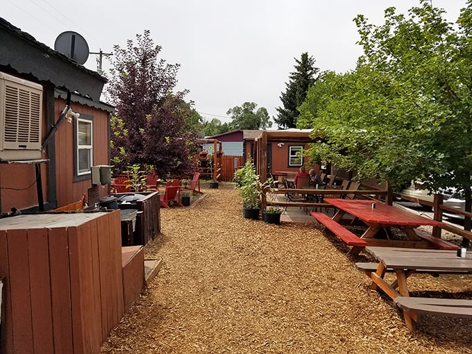 Rustic charm meets backyard comfort in this dining area. The perfect spot to savor your BBQ bounty.
