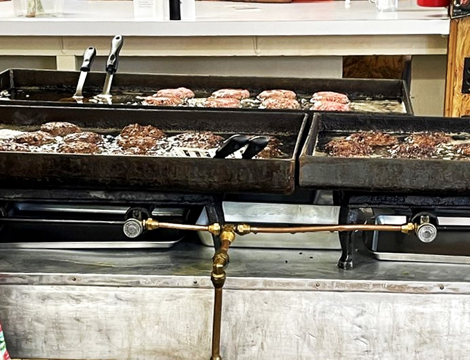 Sizzle central! This grill has seen more action than a Hollywood stuntman, and it's still going strong.