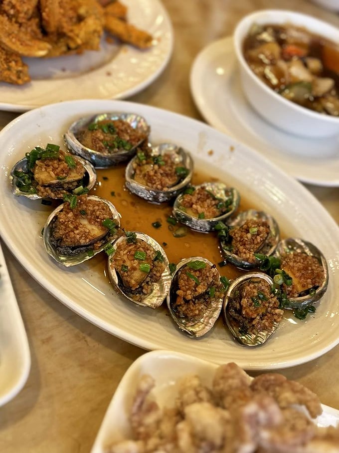 Garlic abalone: for when you want your breath to be as memorable as your meal. These little flavor bombs are like the ocean's answer to escargot.