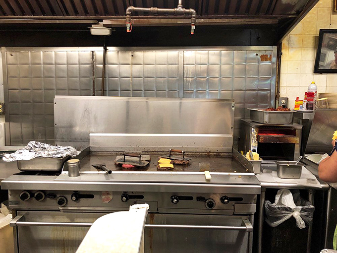 Behold, the altar of deliciousness! This grill has probably seen more action than a Hollywood stuntman.