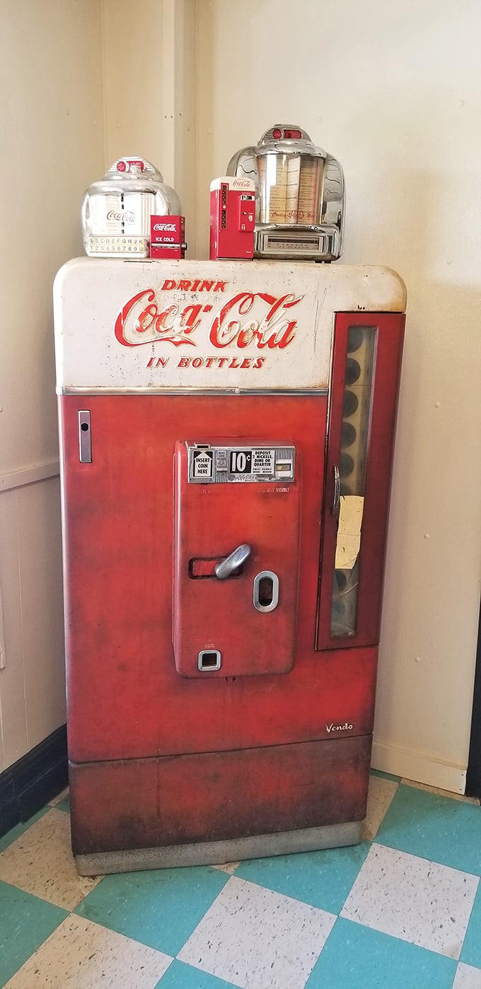 Great Scott! This vintage Coca-Cola machine isn't just a soda dispenser, it's a time machine. One sip and you're back in the fabulous fifties!