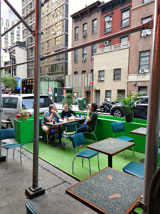 Alfresco dining, New York style. Where your side dish is a heaping helping of people-watching with a sprinkle of street symphony.