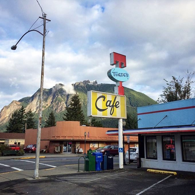 Small town charm, big mountain energy! Twede's sign stands tall, inviting you to come for the food and stay for the breathtaking views.
