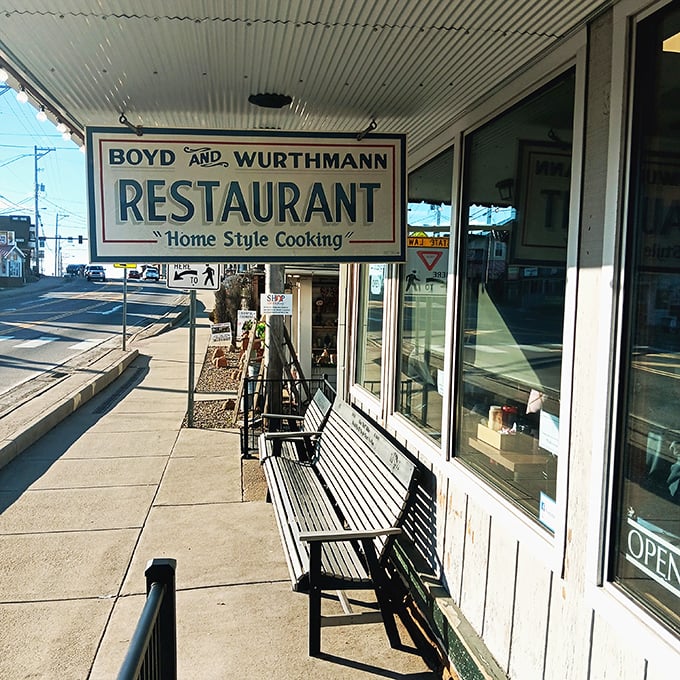 The weathered bench outside isn't just seating&mdash;it's a waiting room where strangers become temporary friends united by the universal language of hunger.