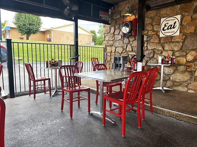 "Al fresco dining, 50s style! These cherry-red chairs are calling your name louder than a jukebox playing 'Johnny B. Goode'."