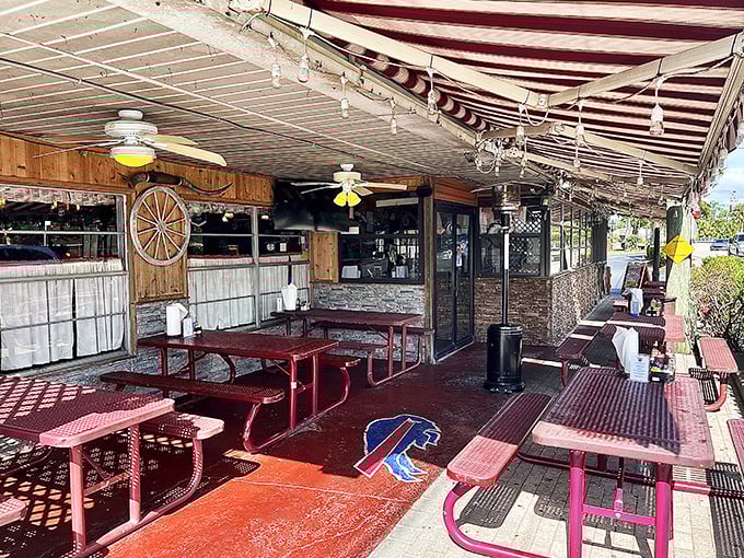 The outdoor patio offers the classic Florida dining experience: sunshine, picnic tables, and the anticipation of wings that justify any wait.