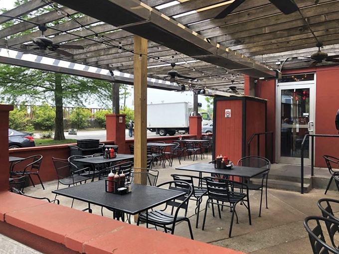 Outdoor dining that says, "Come for the barbecue, stay for the perfect Atlanta afternoon." Those red walls have heard many food-induced sighs of happiness.