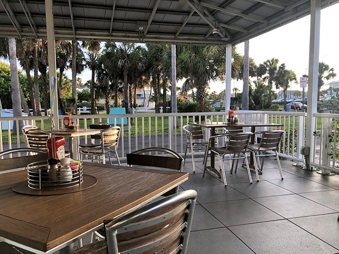 Al fresco feast: Dine with a side of vitamin D on this breezy patio, where palm trees provide nature's air conditioning.