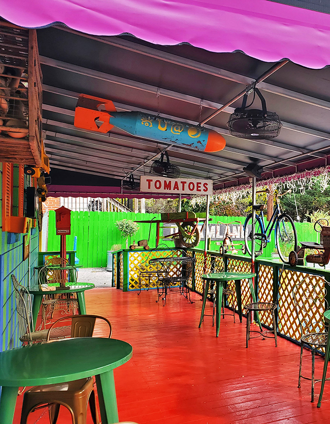 Outdoor dining with a side of whimsy! This patio is like your cool aunt's backyard &ndash; if she were an artist with a penchant for primary colors.