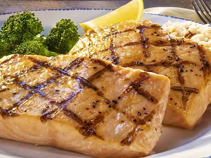 Salmon so perfectly grilled, it might just swim upstream to your plate. A taste of the wild, tamed by expert chefs.