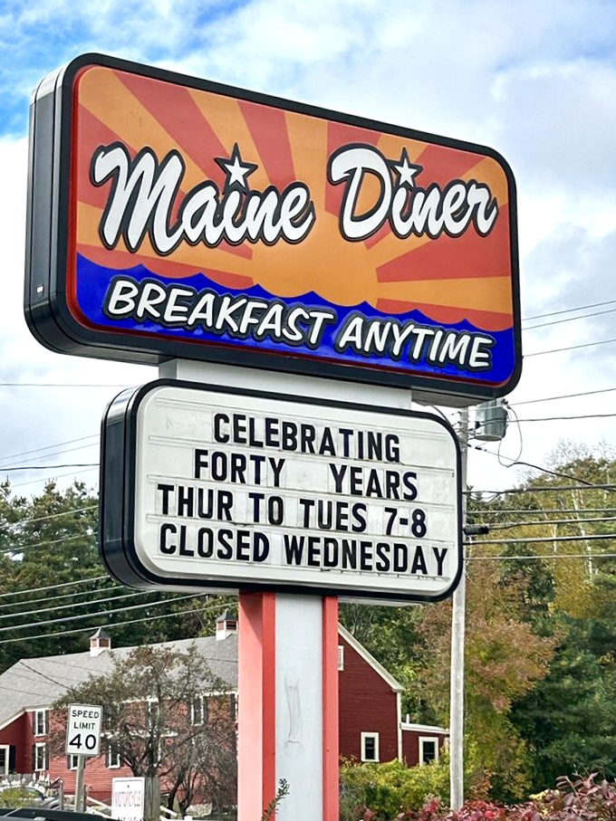 Forty years of feeding hungry souls! This sign is like a beacon of hope for empty stomachs, promising "Breakfast Anytime" - words to live by, if you ask me.