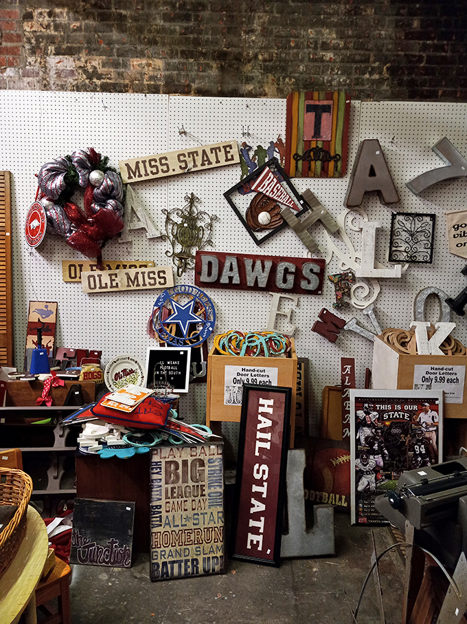 College rivalries immortalized in decor! This wall is like a playful battleground for Mississippi's sports fans.