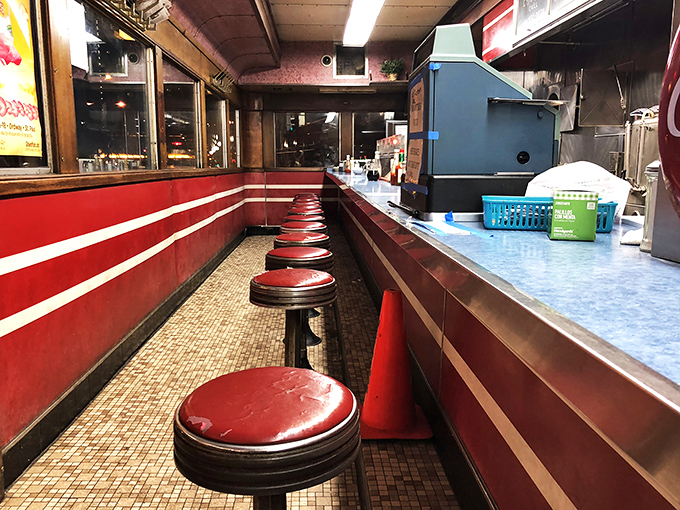 Pull up a stool and stay awhile. These red vinyl thrones have witnessed more stories than a librarian on overtime.