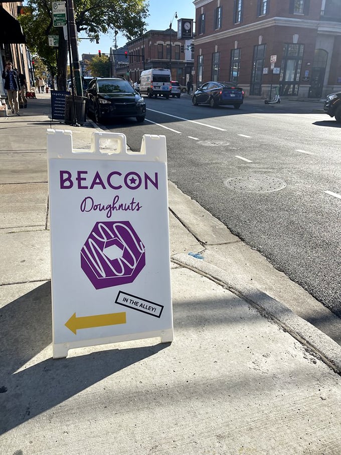 Follow the purple brick road! This sign isn't just directions; it's an invitation to adventure. Your taste buds will thank you later.