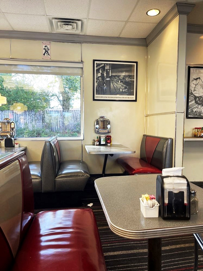 Cozy corner alert! This booth is the perfect spot for solving the world's problems over a burger and fries.