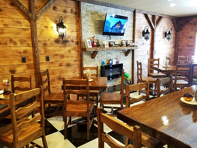 Tables arranged with the perfect balance of privacy and community. The stone fireplace wall could convince you you're dining in a Krakow countryside inn.