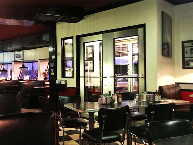 Booths aren't just seating arrangements; they're private conference rooms where life's big decisions get made over coffee refills.