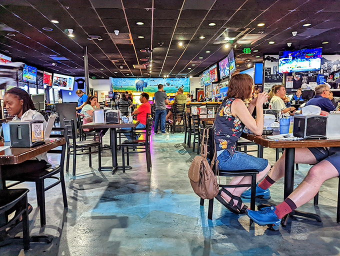 The bustling dining room where strangers become friends over shared wing enthusiasm. Notice the concrete floors&mdash;practical for inevitable sauce incidents.