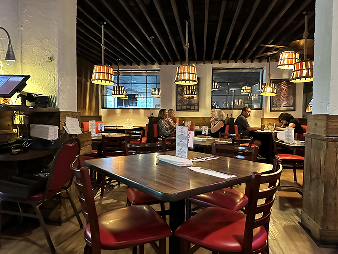 A sea of satisfied faces! These diners look like they've just discovered the meaning of life in their seafood platters.