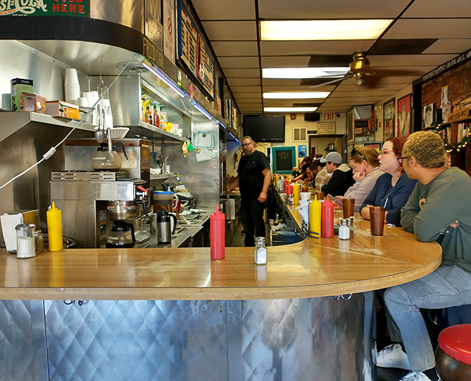Where everybody knows your name... or at least your usual order. This bustling counter is the heart of the diner, serving up plates of nostalgia with a side of friendly banter.