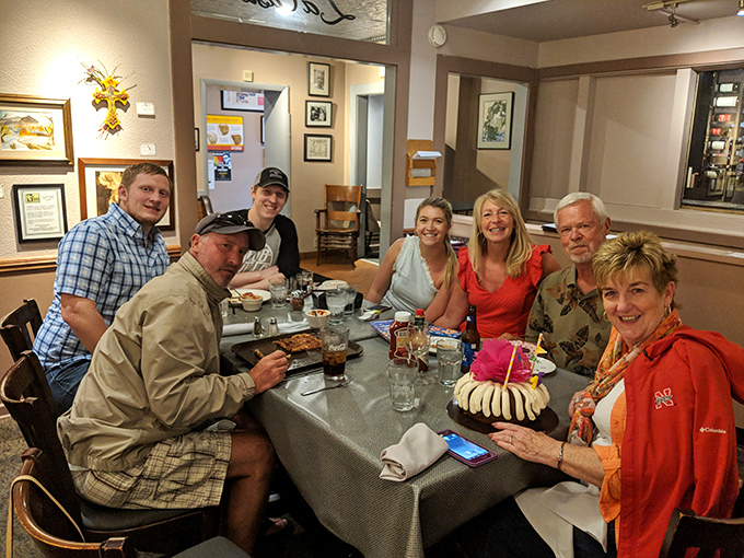 Happy diners, happy times! This group looks like they've discovered the secret to eternal youth &ndash; and it's spelled P-I-Z-Z-A.