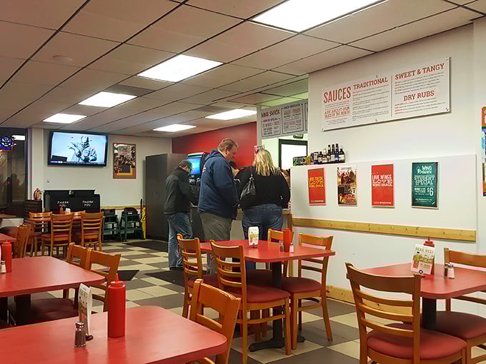 A sea of red tables and happy diners. It's like a support group for wing addicts, and everyone's welcome!