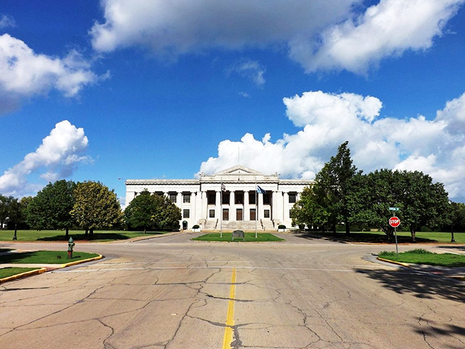 "Guthrie's Grand Dame" This stately white building with its wrap-around porch is giving serious "sipping sweet tea and gossiping" vibes. Southern hospitality at its finest!