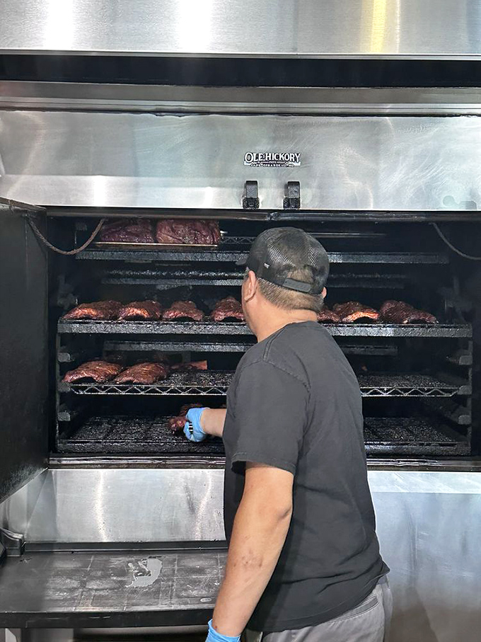 Where the magic happens! This pitmaster is like a conductor, orchestrating a symphony of smoke and flavor.
