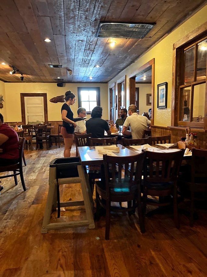 The dining room: Where rustic charm meets seafood dreams. Those wooden booths look like they've heard some good stories&mdash;and seen some empty plates.