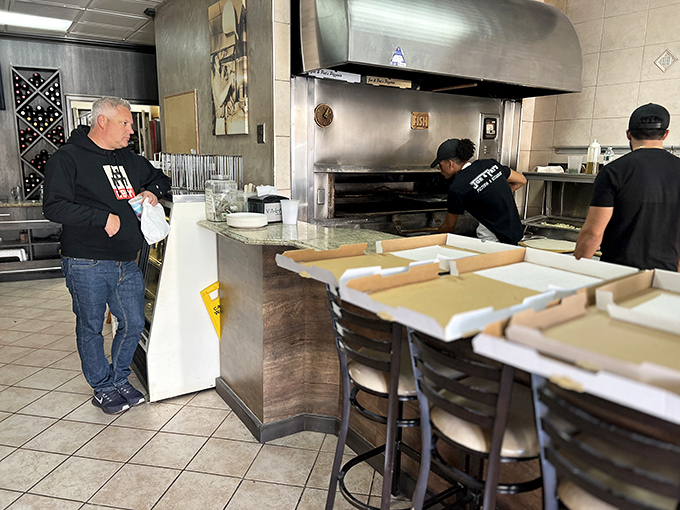 Where the magic happens! The staff at Joe & Pat's are the unsung heroes, turning dough into dreams one pie at a time.