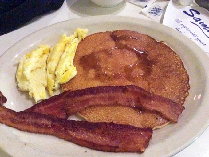 Pancakes so golden, they could be mistaken for sunrise. And that bacon? Crispy perfection that would make Ron Swanson proud.