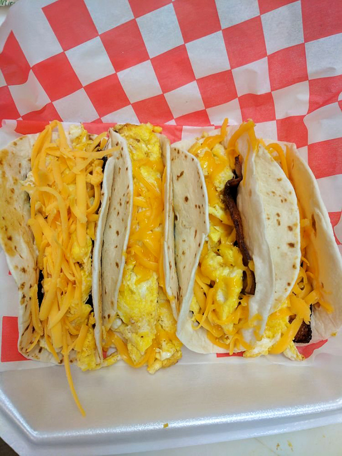 Breakfast tacos that blur the line between morning fuel and midday indulgence. That yellow cheese isn't just a topping&mdash;it's a commitment to happiness.