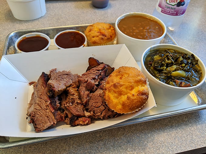 A brisket feast fit for a king! With cornbread and sides, it's like a southern comfort food royal flush on a tray.