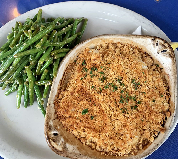 Broiled scallops that are pure ocean poetry. Paired with those vibrant green beans, it's a plate that's almost too pretty to eat. Almost.