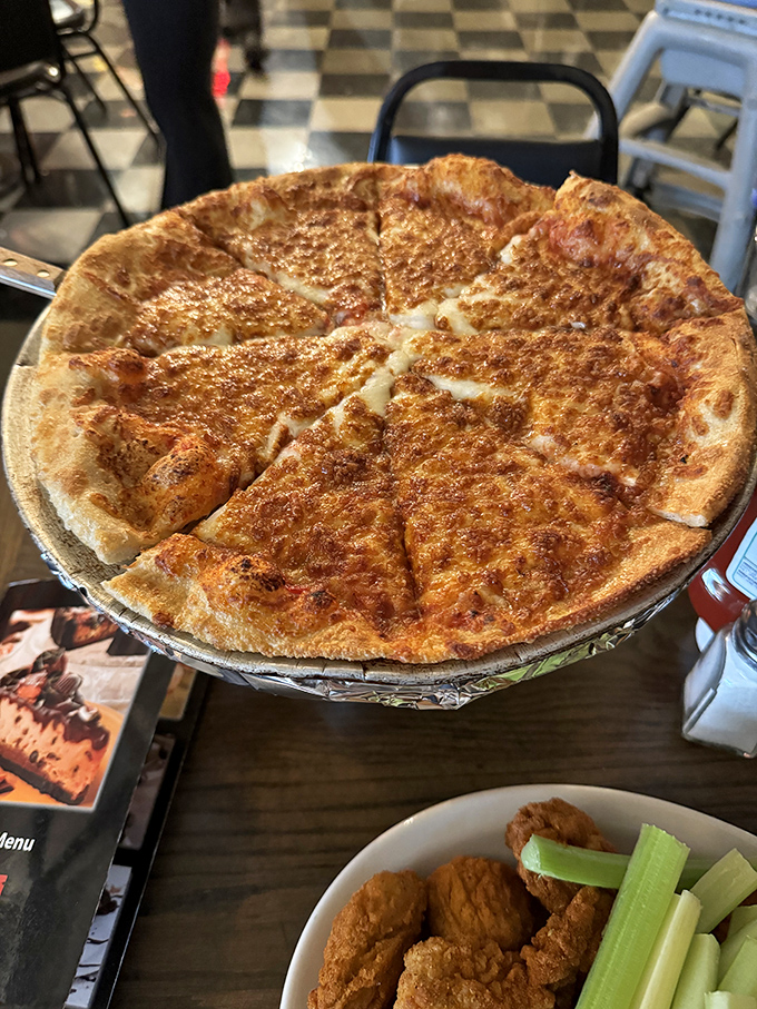 The often-overlooked pizza at Anchor Bar deserves its own spotlight &ndash; a crispy, cheese-laden disc that would be famous anywhere else.