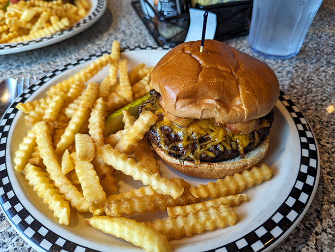 Burger bliss achieved! This towering masterpiece of beef and cheese is the stuff of fast-food fever dreams.