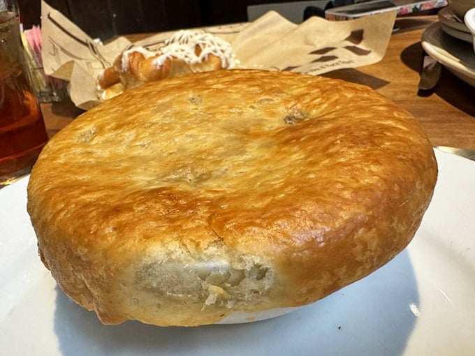 This chicken pot pie isn't messing around&mdash;a golden dome of pastry hiding a savory treasure of chicken and vegetables underneath.