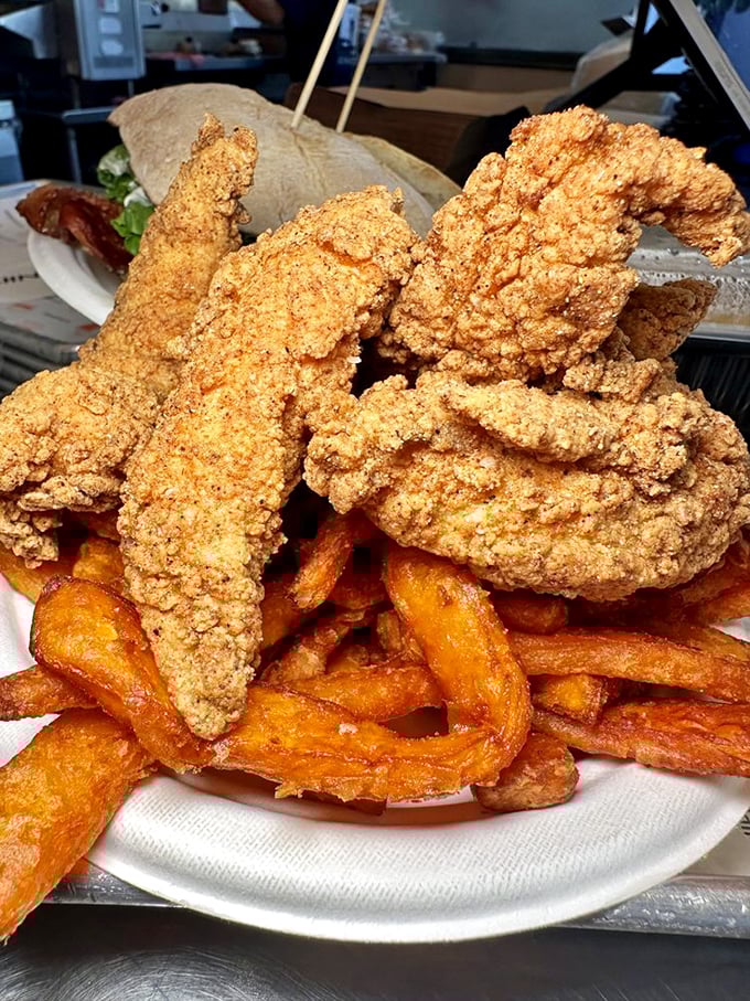 Chicken fingers and sweet potato fries that make you question why you ever bothered with "grown-up food." Crispy, golden perfection on a plate.