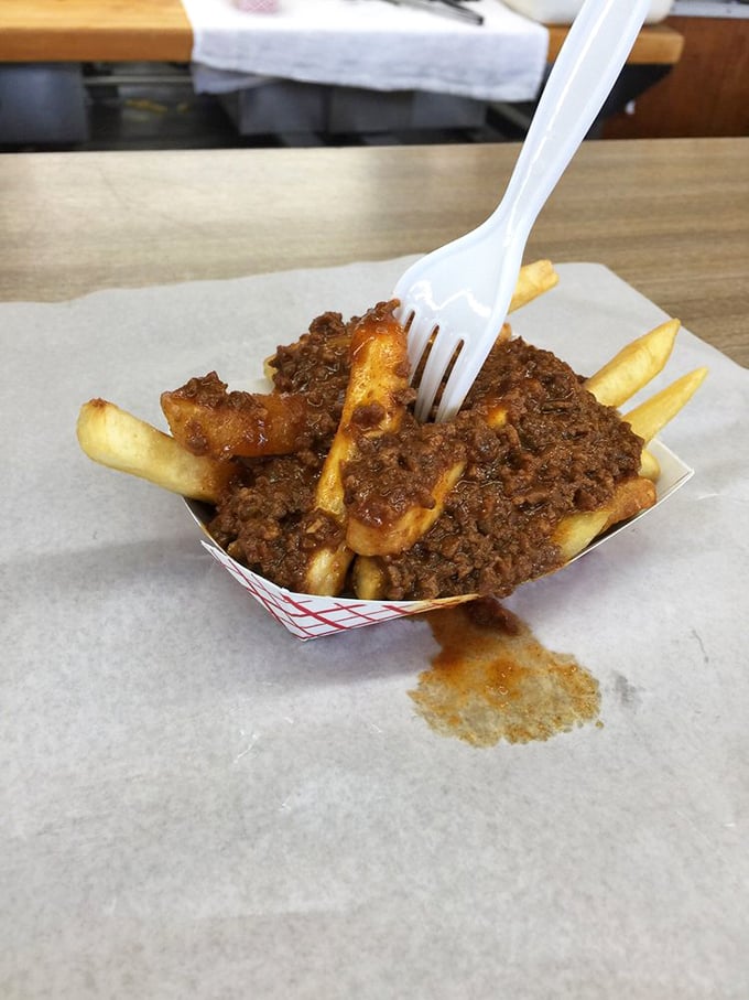 Fries that'll make you forget your name! Crispy, golden, and smothered in meaty chili &ndash; resistance is futile, just grab a fork and dive in.