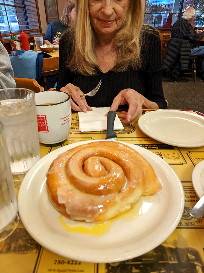 The cinnamon roll: a spiral of sweetness so large, it has its own gravitational pull on forks.