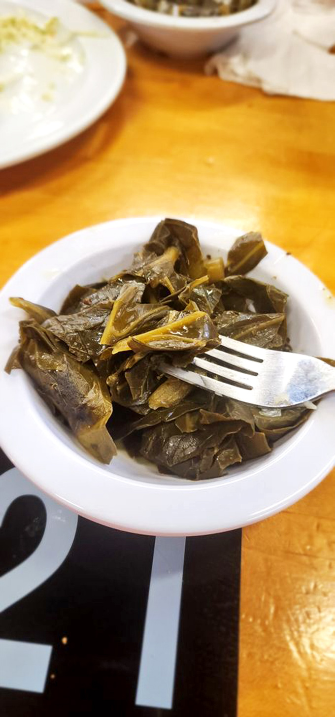 Collard greens simmered to that perfect Southern sweet spot &ndash; where vegetables somehow become both virtuous and deliciously sinful.