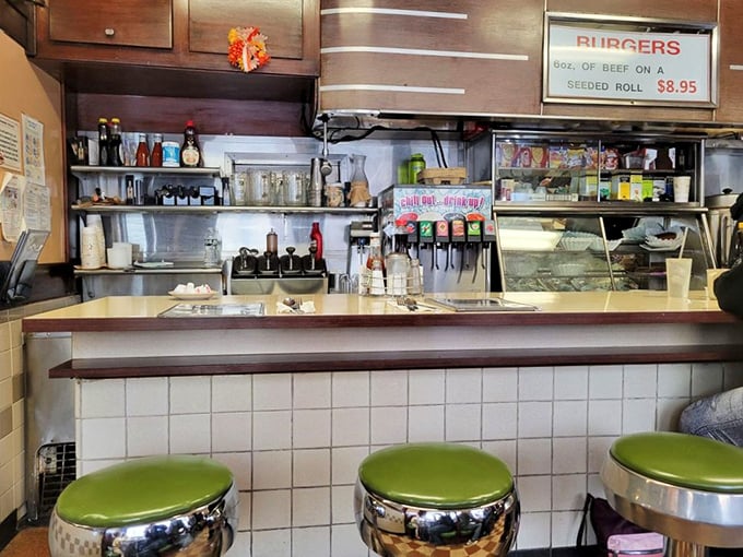 The counter where breakfast dreams come true. Those green vinyl stools have supported generations of happy eaters.