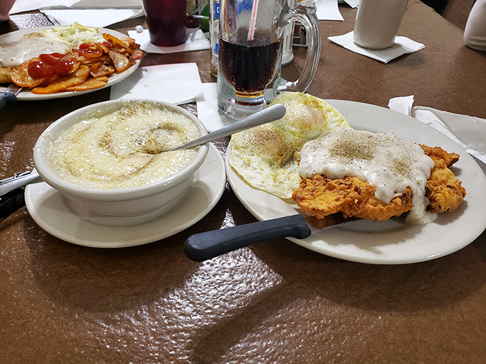 Southern comfort on a plate. This country-fried chicken with creamy grits is like a warm hug from your favorite aunt.