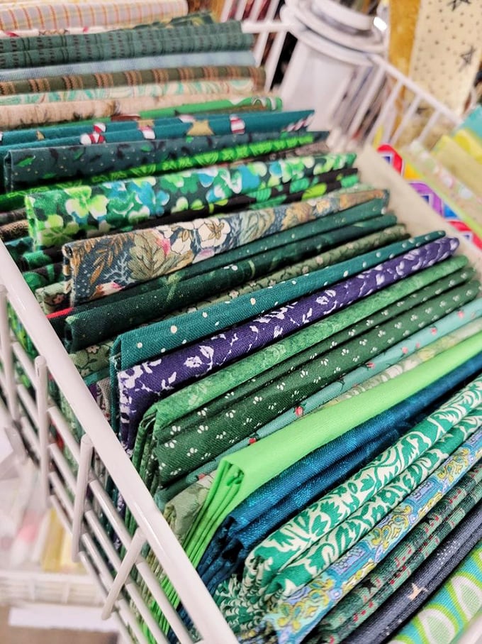 Craft supply heaven or fabric fantasy land? Either way, this colorful corner is where DIY dreams are born and creativity runs wild.
